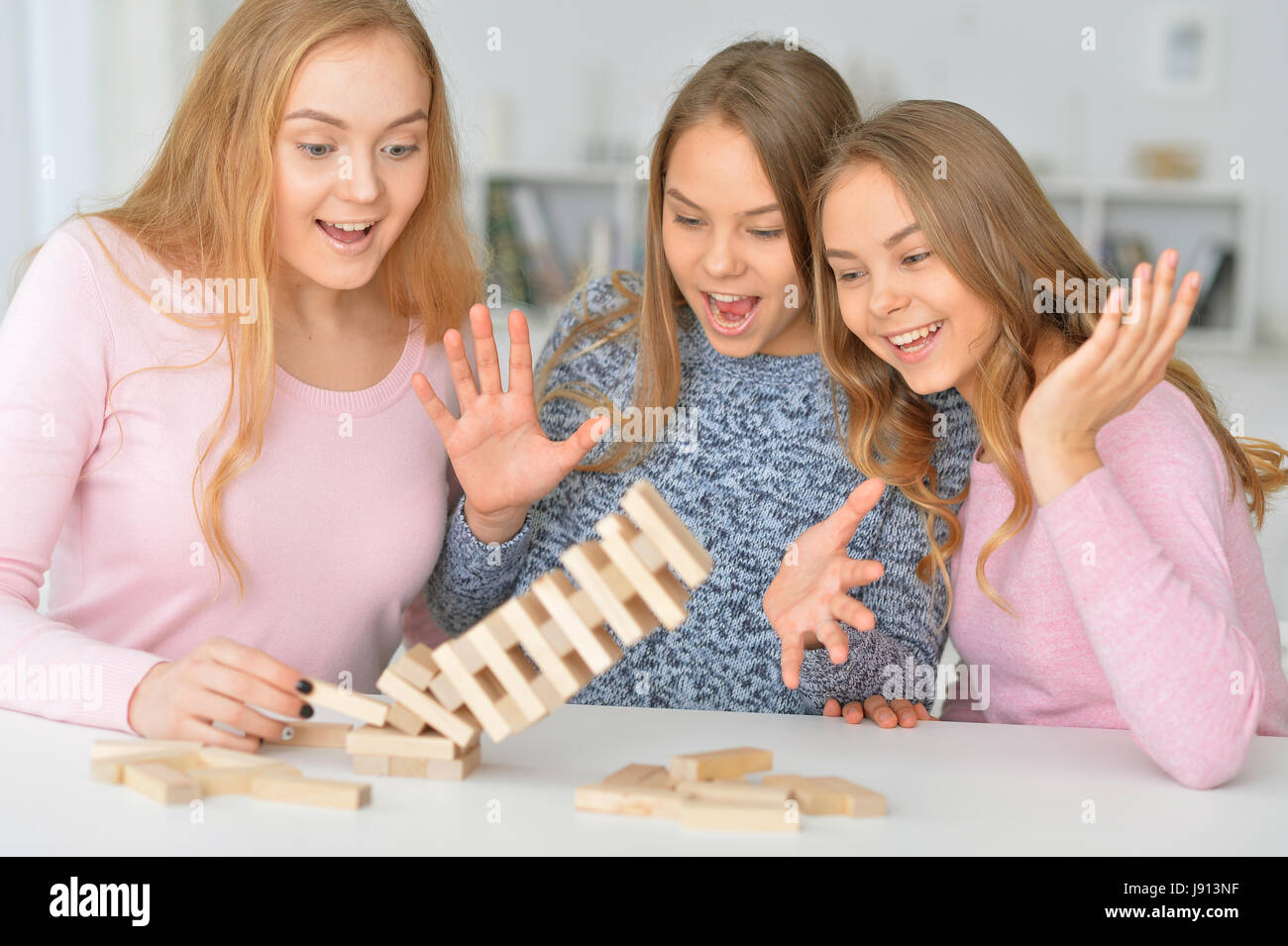 Three Teenage Girls Playing With Wooden Blocks Stock Photo Alamy three-teenage-girls-playing-with-wooden-blocks-stock-photo-alamy