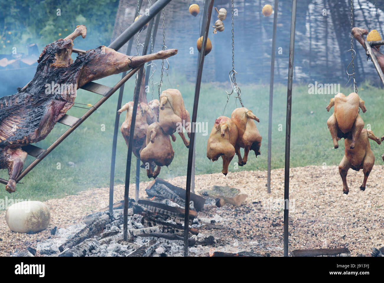 Argentinian fire pit cooking chickens and Lamb at Daylesford Organic ...