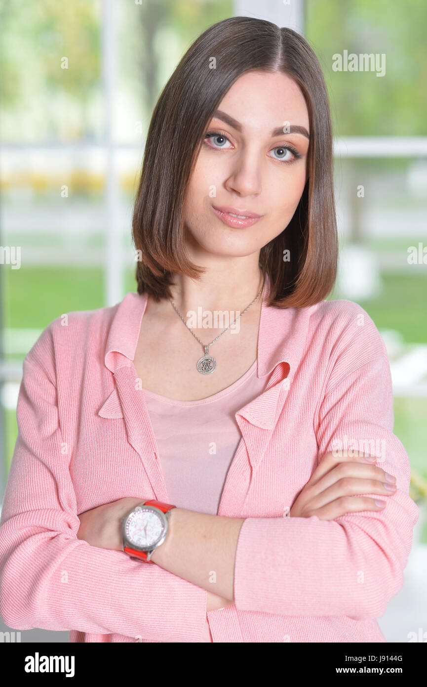 Portrait of a beautiful girl by the window Stock Photo - Alamy