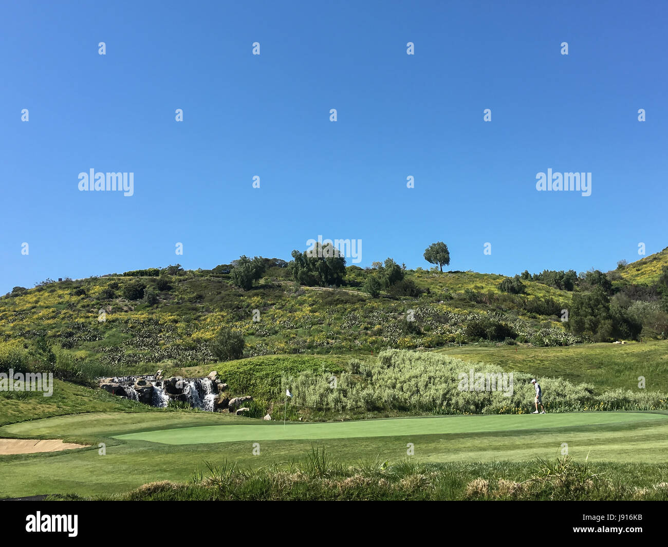 Beautiful golf course and waterfall Stock Photo - Alamy