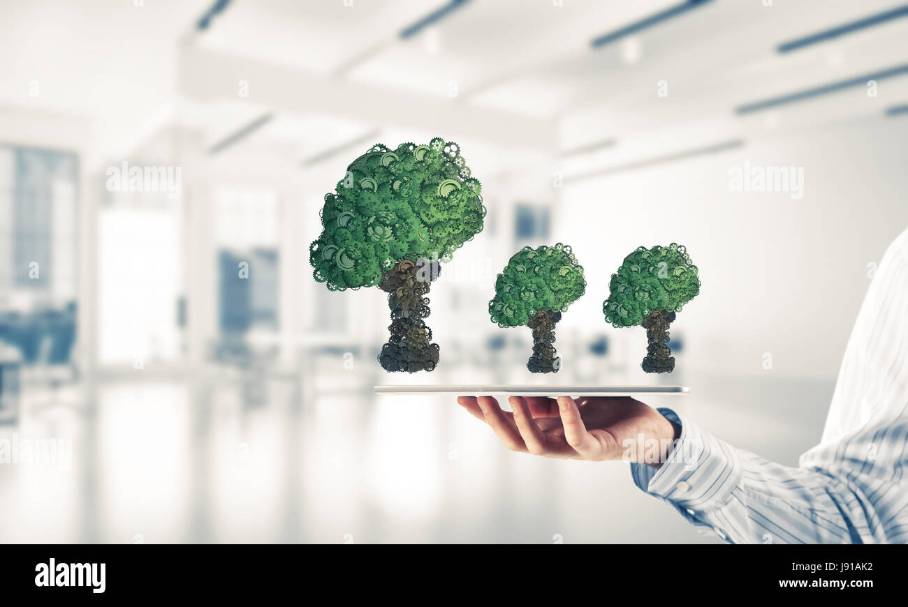 Eco green environment concept presented by tree as working mecha Stock ...