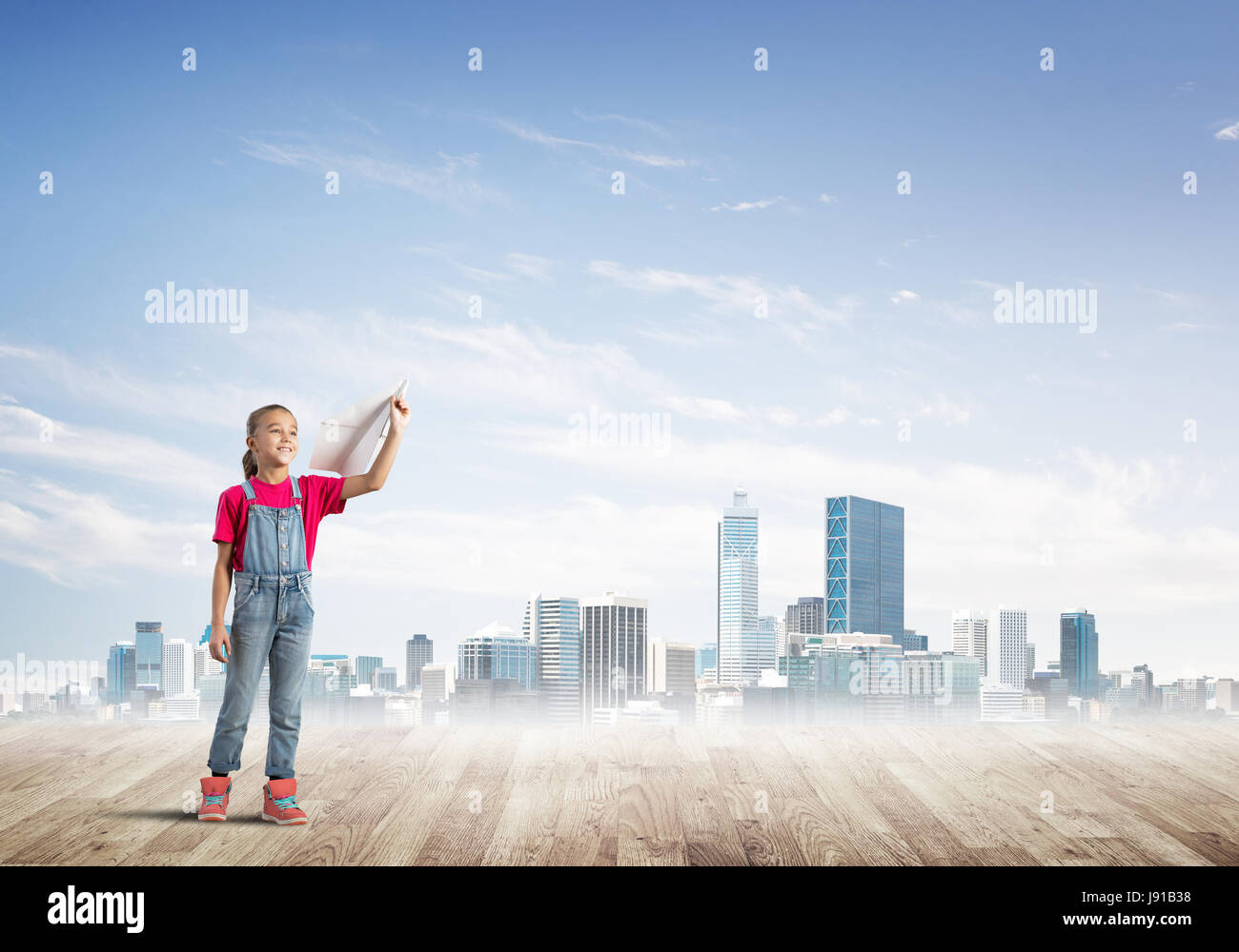 Concept of careless happy childhood with girl dreaming about future ...