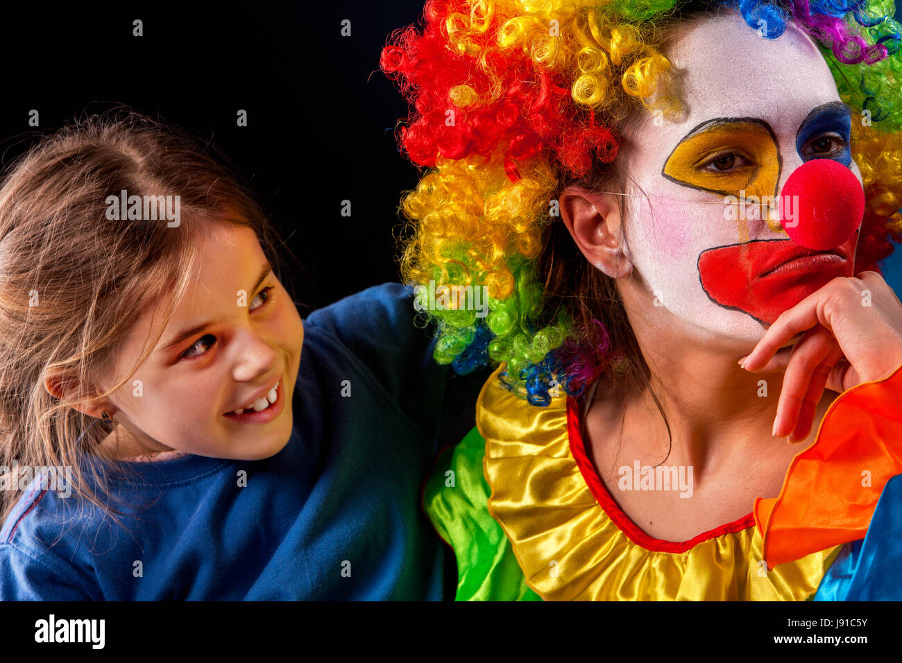 Single parent family. Mom after work birthday clown angry child Stock ...
