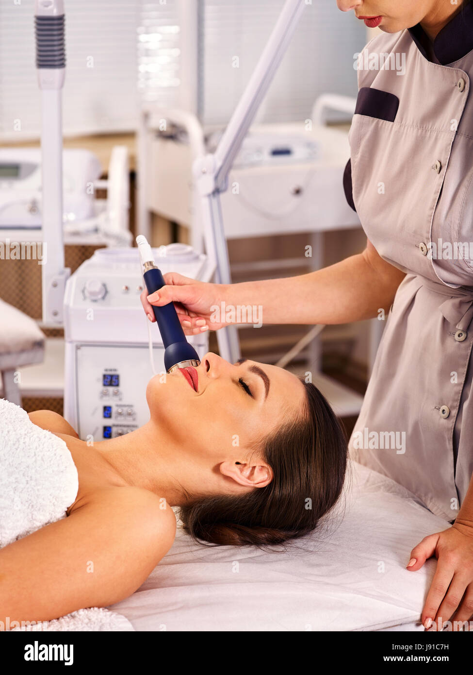 Ultrasonic facial treatment on ultrasound man face machine Stock Photo ...