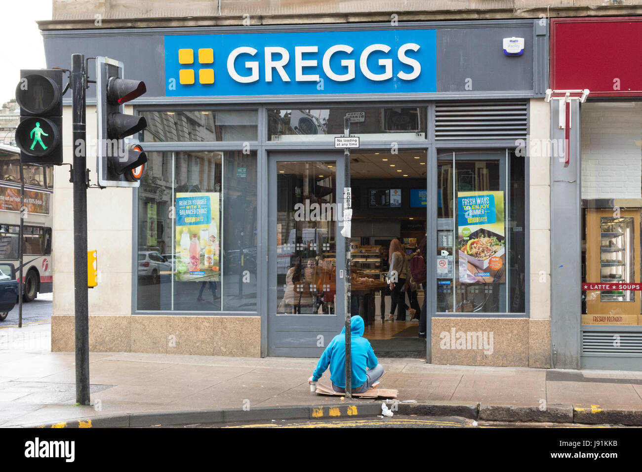 Greggs Sandwich Shop with man begging outside, George Square, Glasgow ...