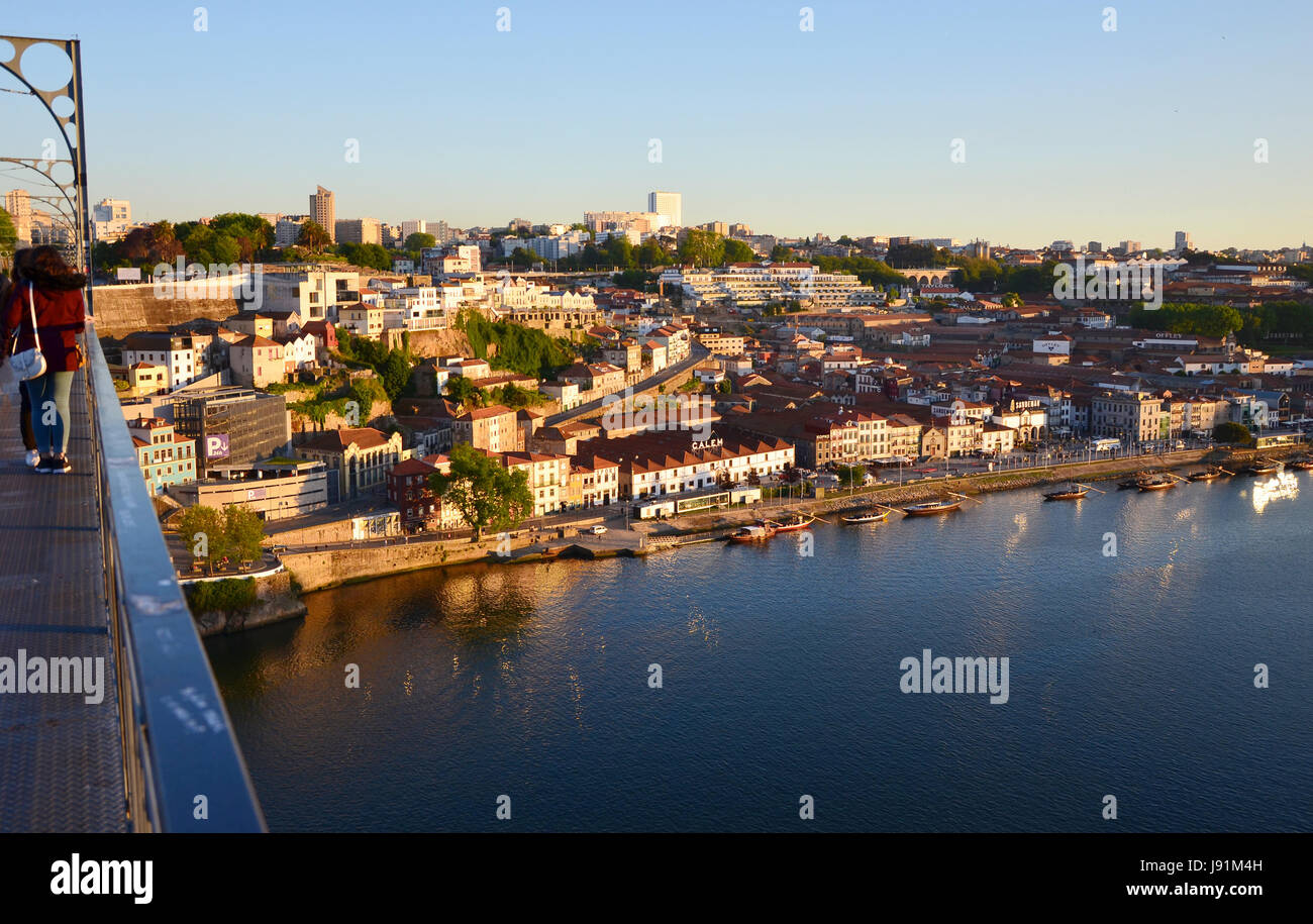 Reflection of the sun at river Douro and city during Sunset, seen from ...