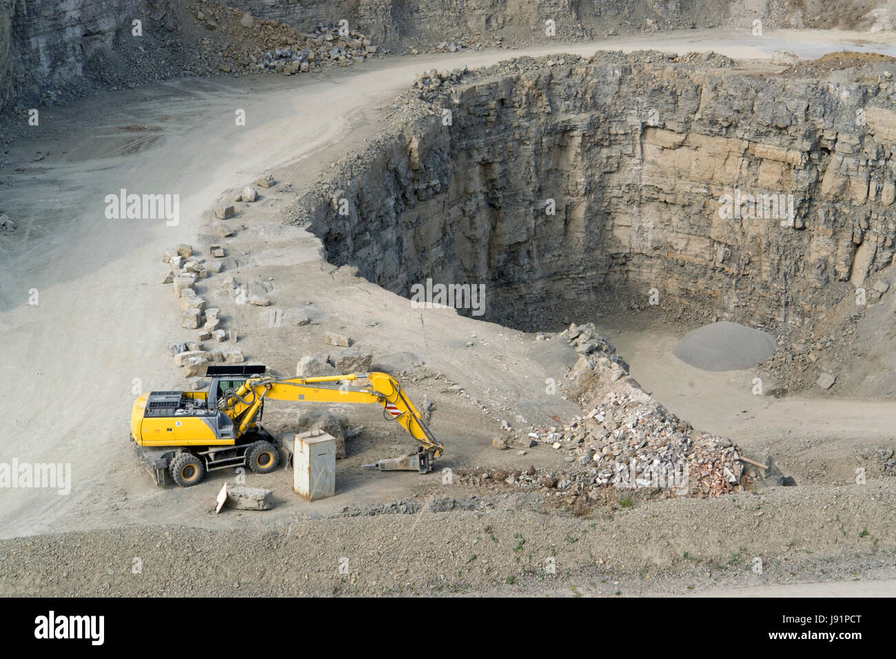 yellow quarry digger Stock Photo - Alamy