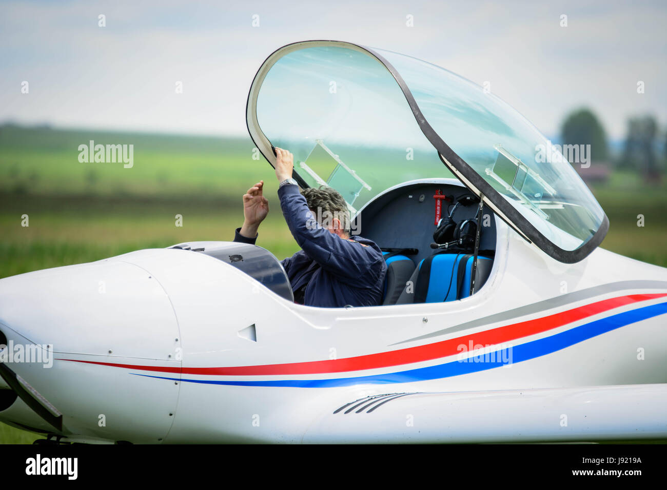 Pilot leaving the cockpit. The end of the flight Stock Photo - Alamy