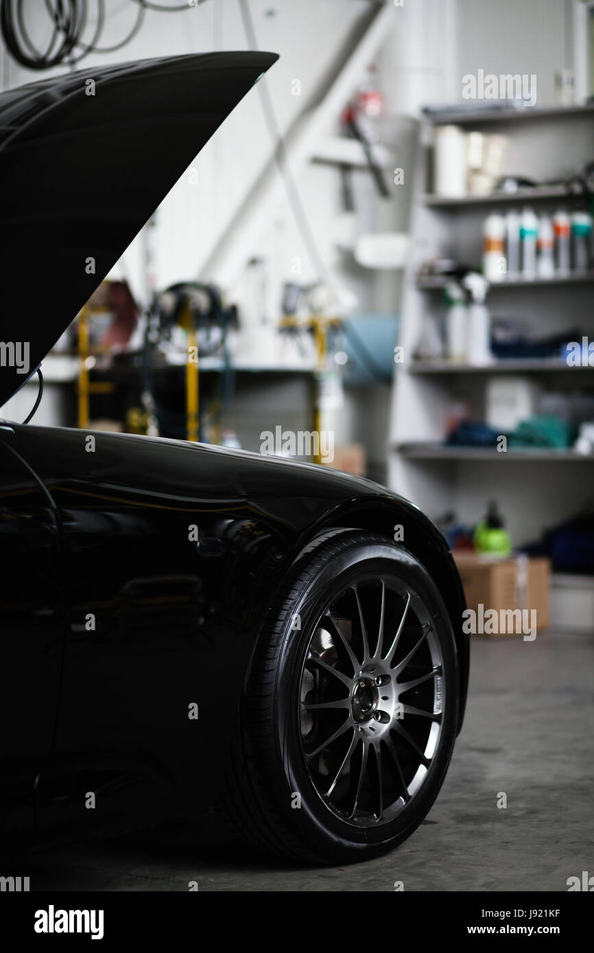 Sports car in a workshop Stock Photo - Alamy