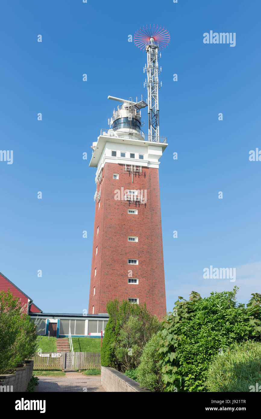 Red lighthouse with telecommunication equipment at German island ...