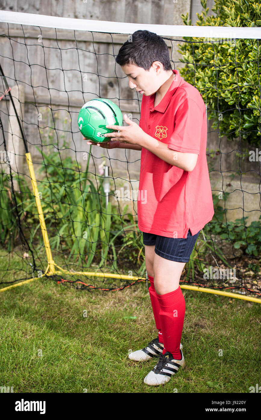 Kids playing soccer garden 9 hi-res stock photography and images - Alamy