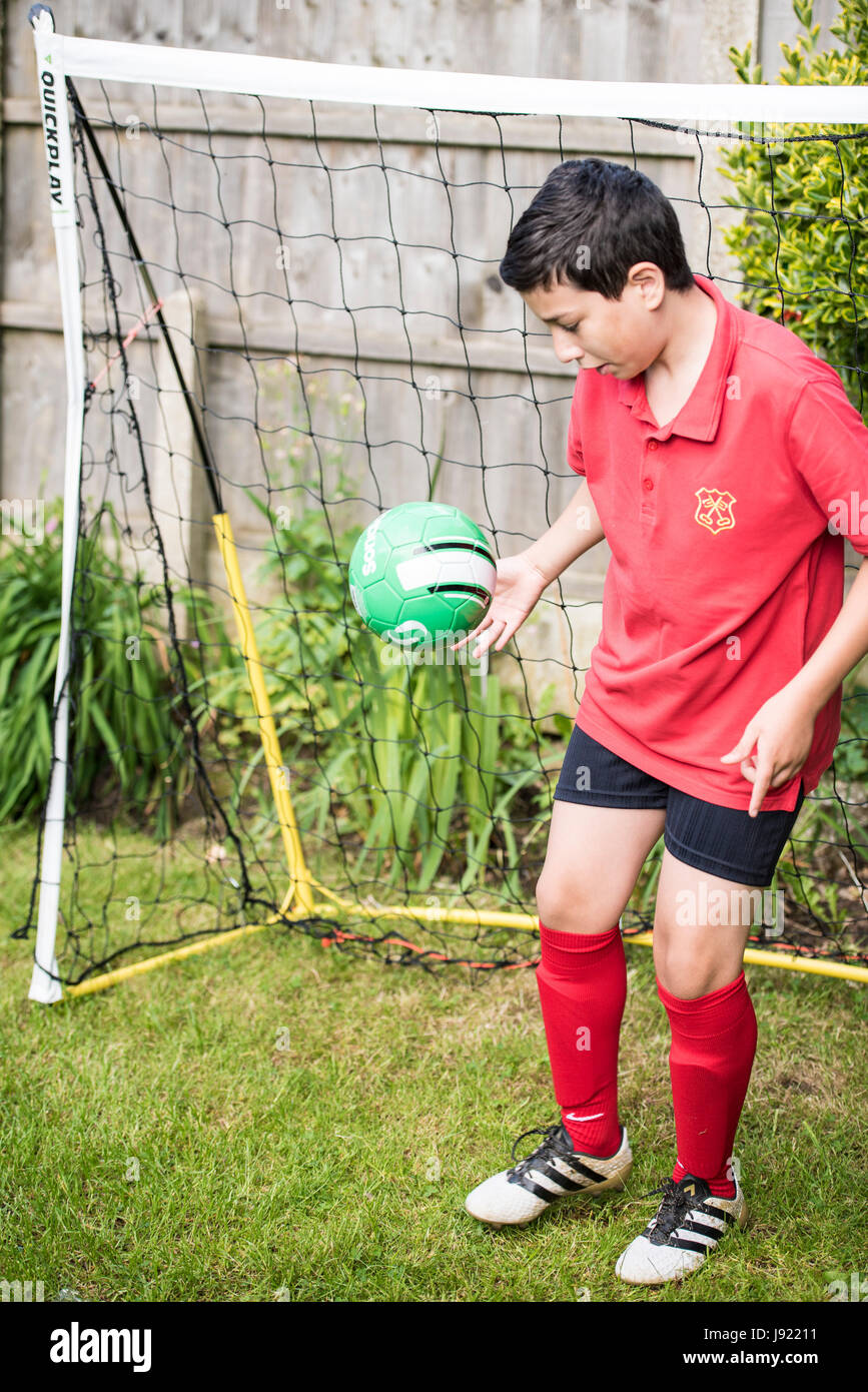 Kids playing soccer garden 9 hi-res stock photography and images - Alamy