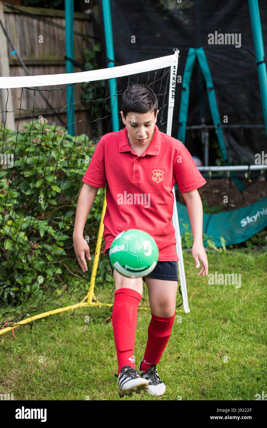 Kids playing soccer garden hi-res stock photography and images - Alamy