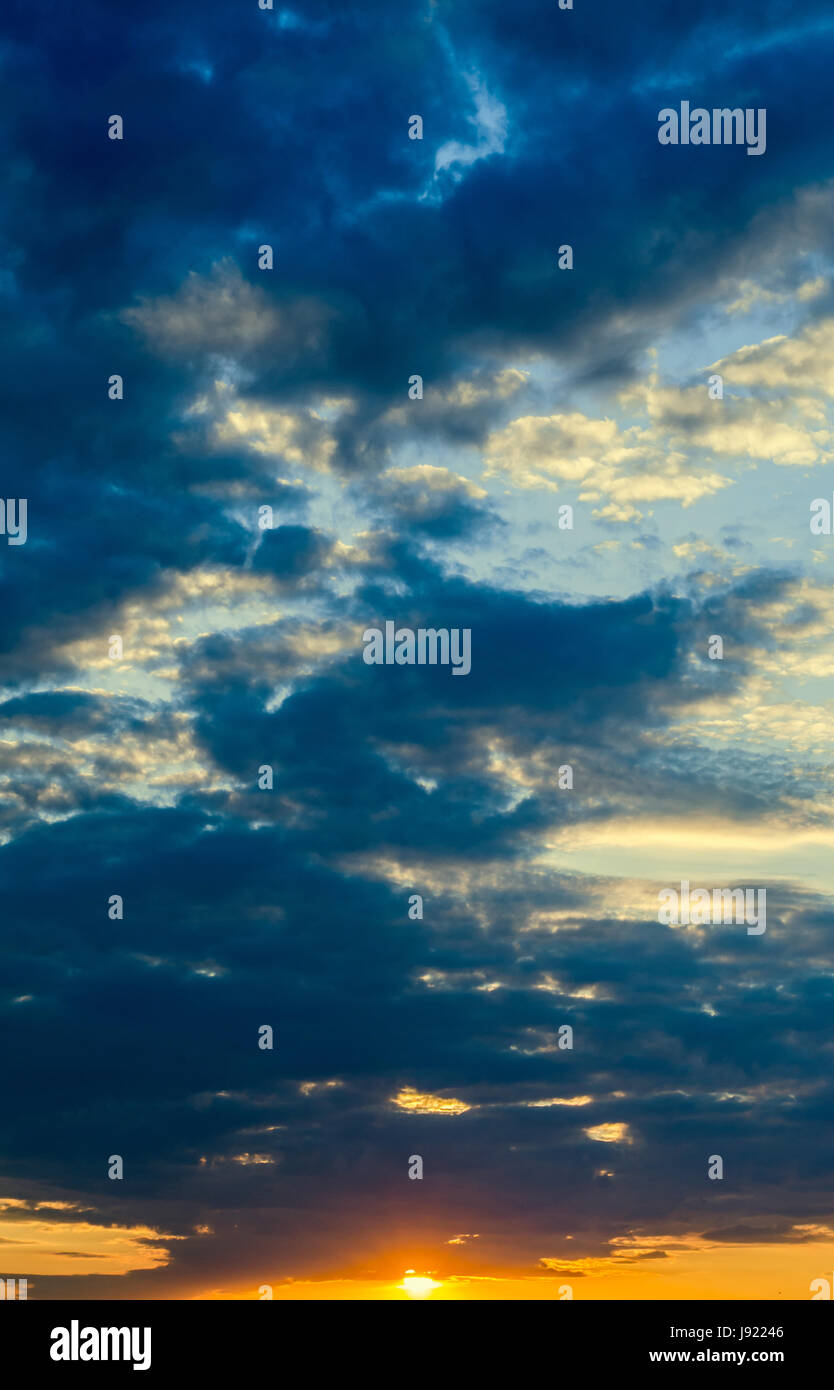 Orange sunset over a european lake, blue clouds sky, colored dramatic ...