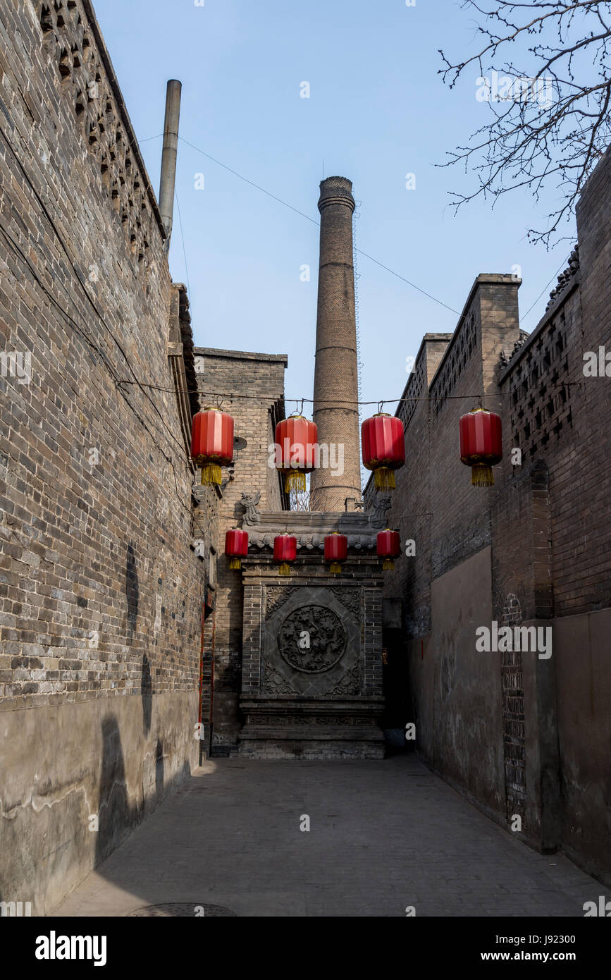 Traditional architecture and industrial chimney, Pingyao, Shanxi ...