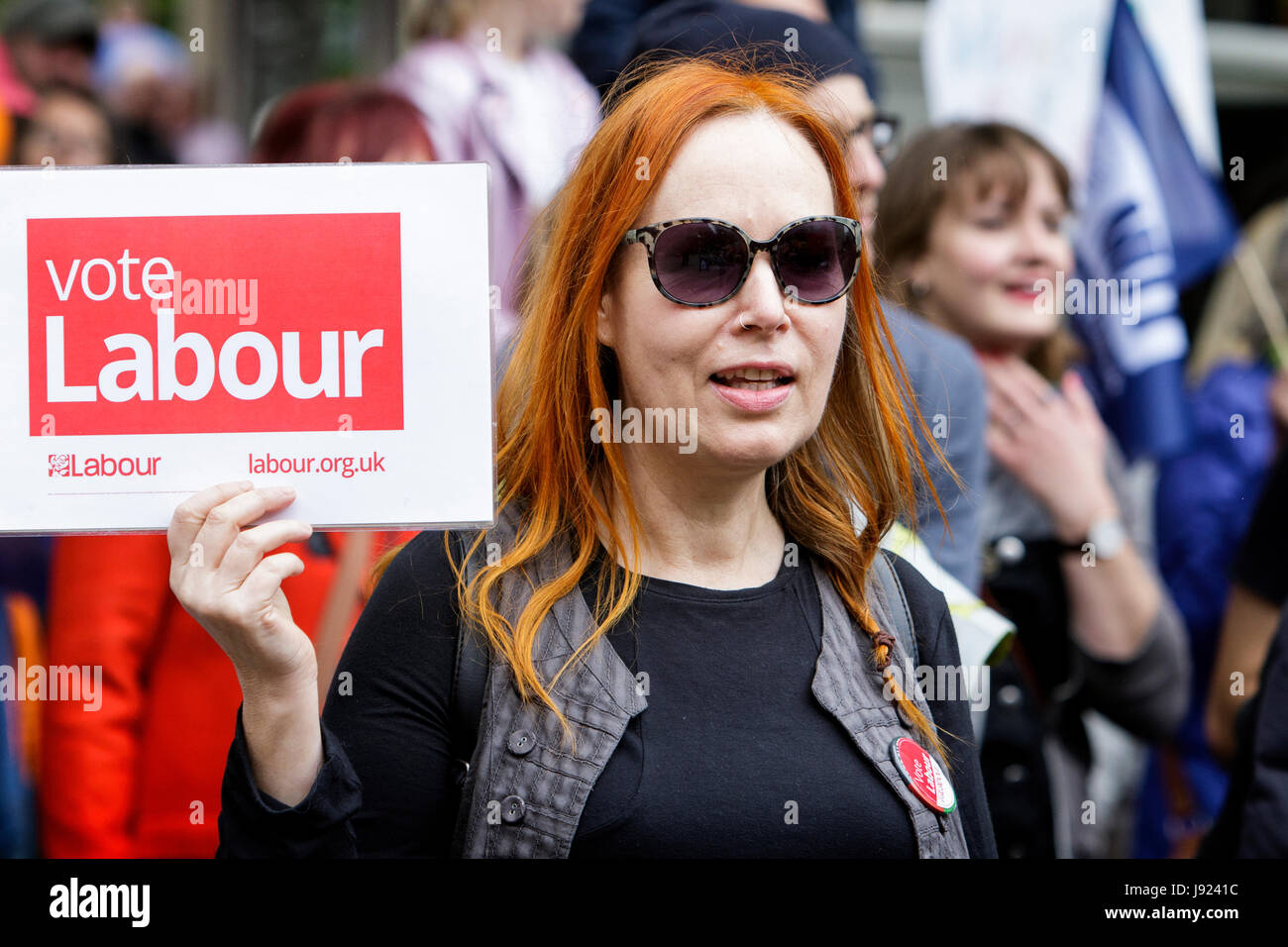 Protesters and Corbyn supporters carrying signs and placards are ...