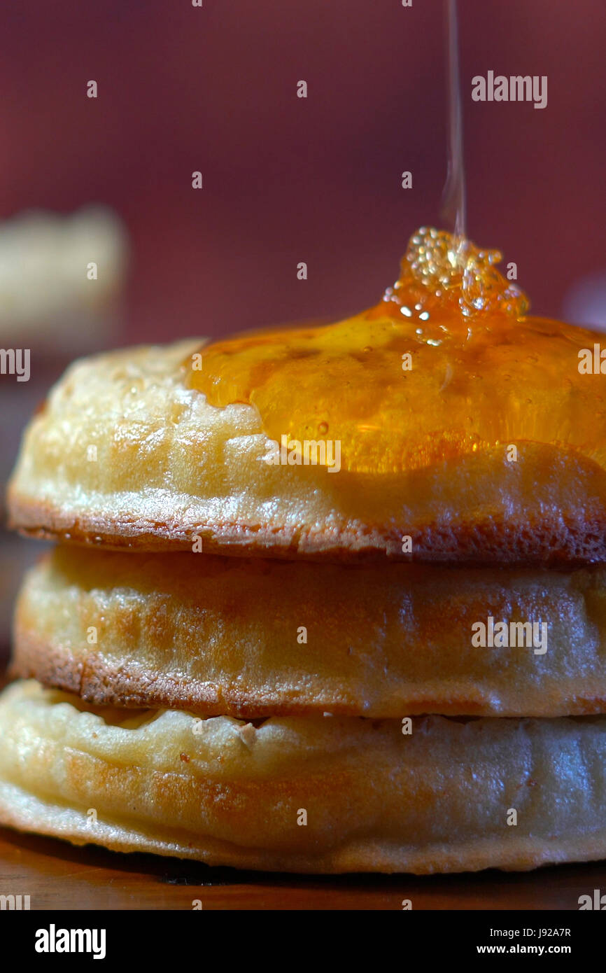 Hot Australian English style breakfast crumpets macro closeup, with ...