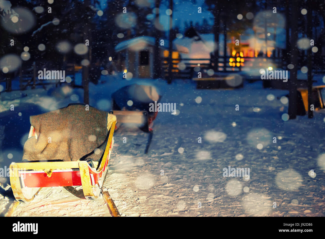 Sledges in the farm in Rovaniemi, Lapland, Finland. Snowfall. Toned ...