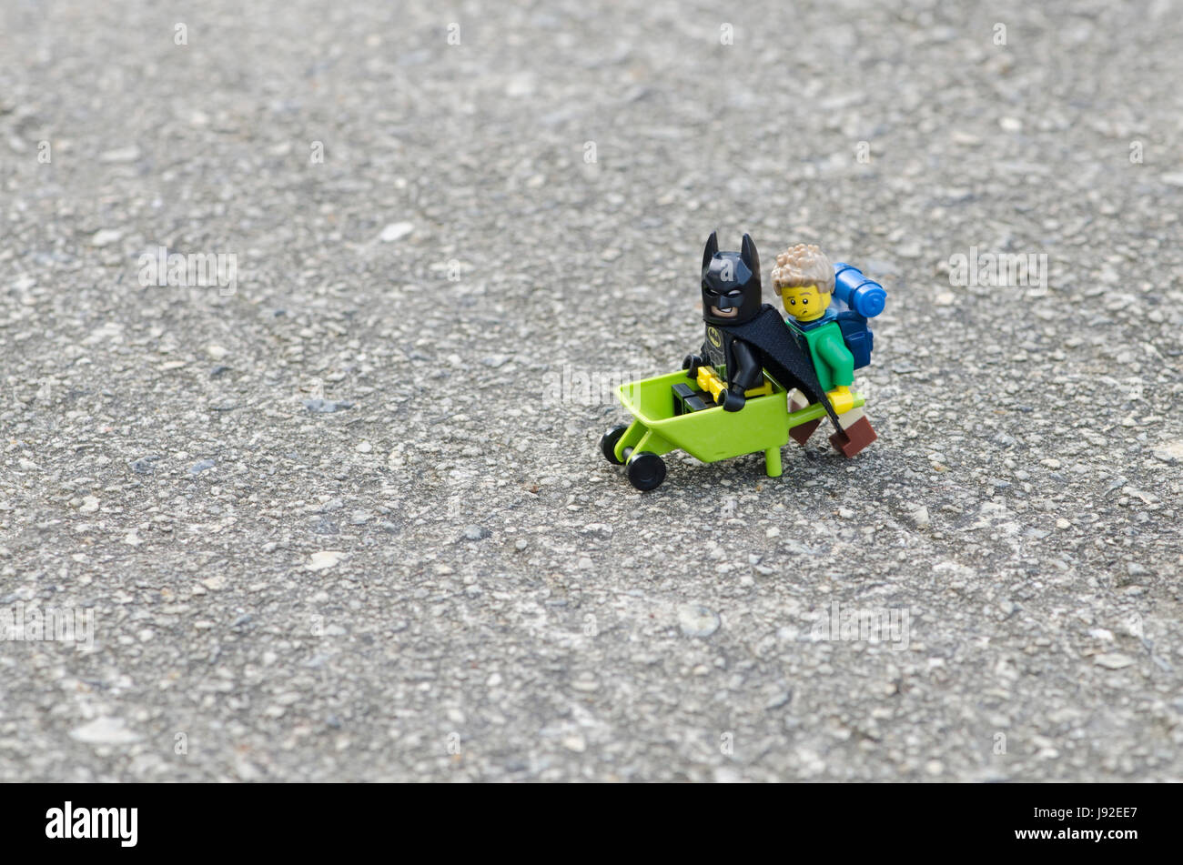 lego batman sitting on wheelbarrow and storm trooper pushing the ...