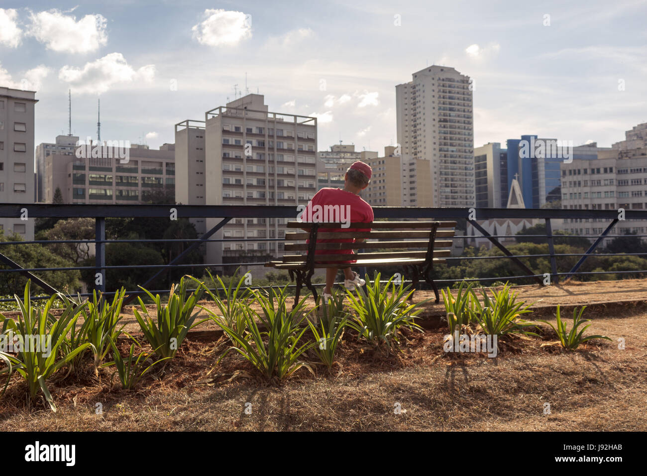 Brazil, São Paulo: Man sitting on a bench on top of Centro Cultural Sao ...