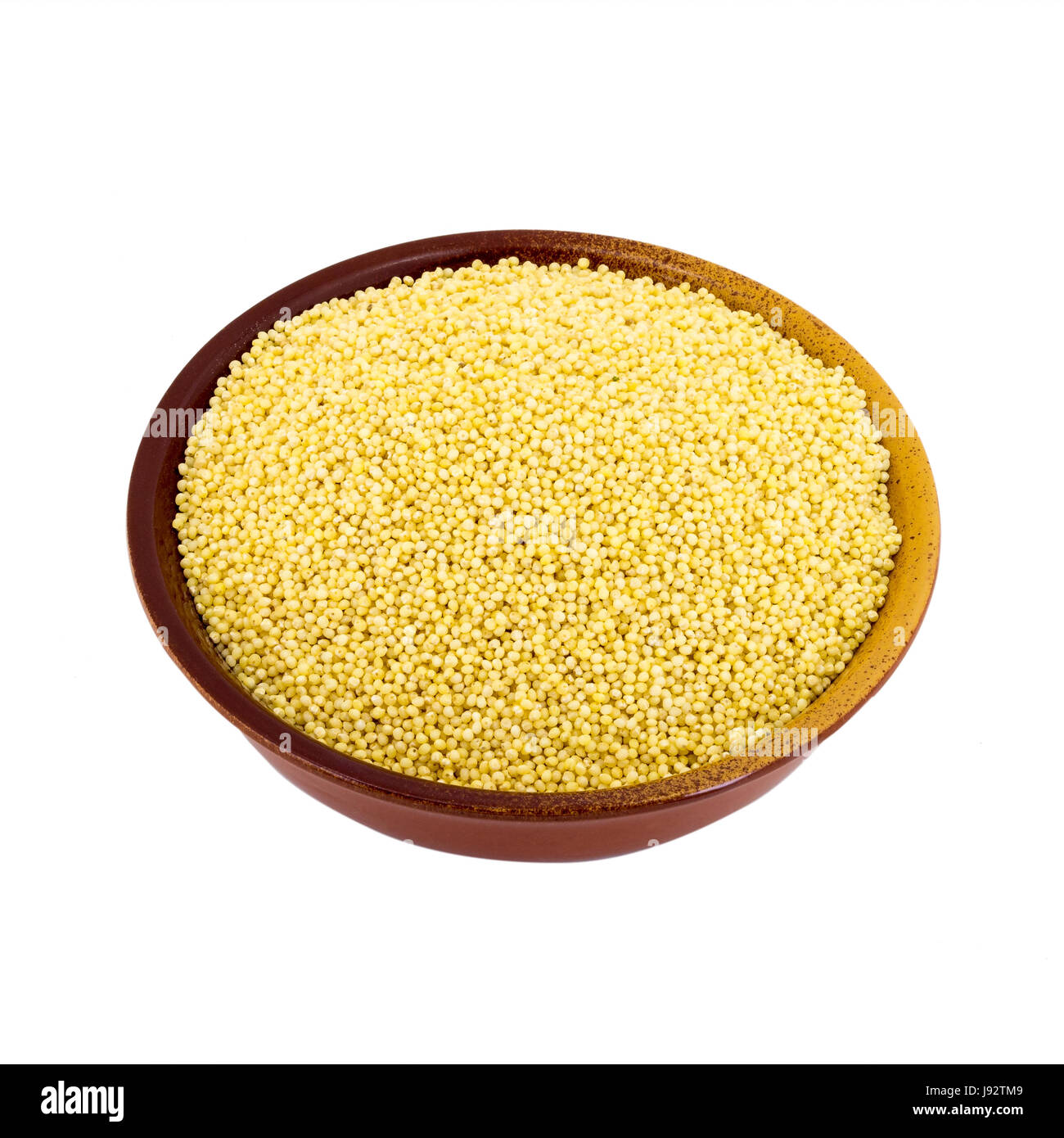Dry raw Millet in brown, ceramic, deep, plate isolated on white ...