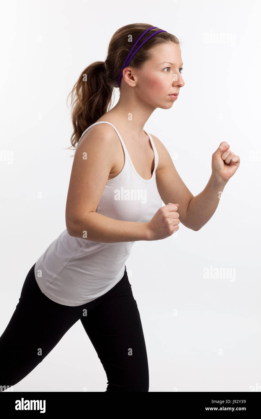 forward-looking dynamic woman with raised fists Stock Photo - Alamy