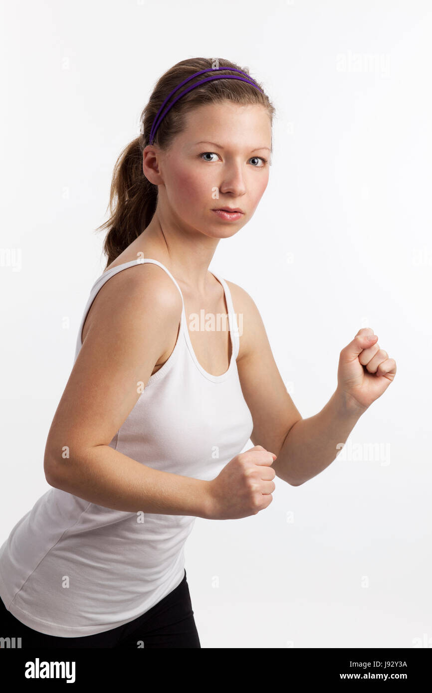 young woman with a determined gaze and upheld fists Stock Photo - Alamy