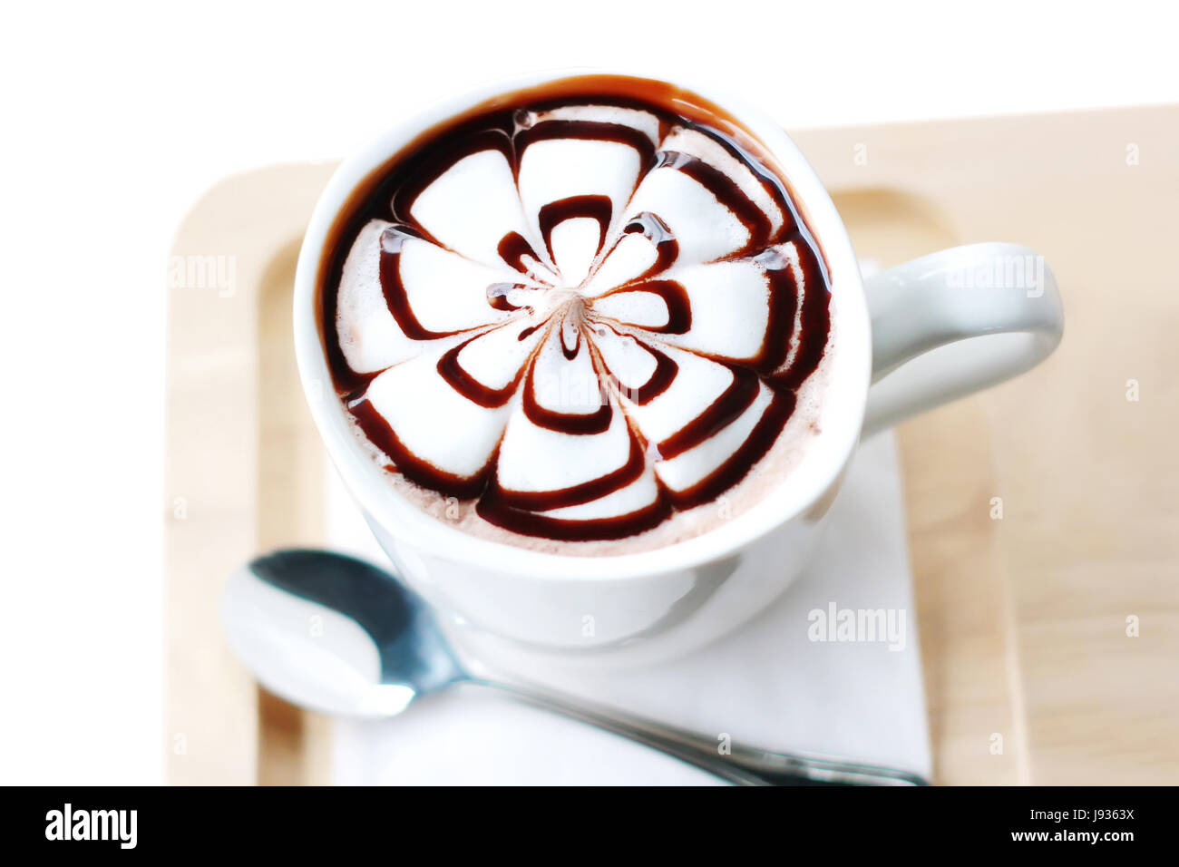 Top view of cup of hot chocolate with foam in the form of flower with ...