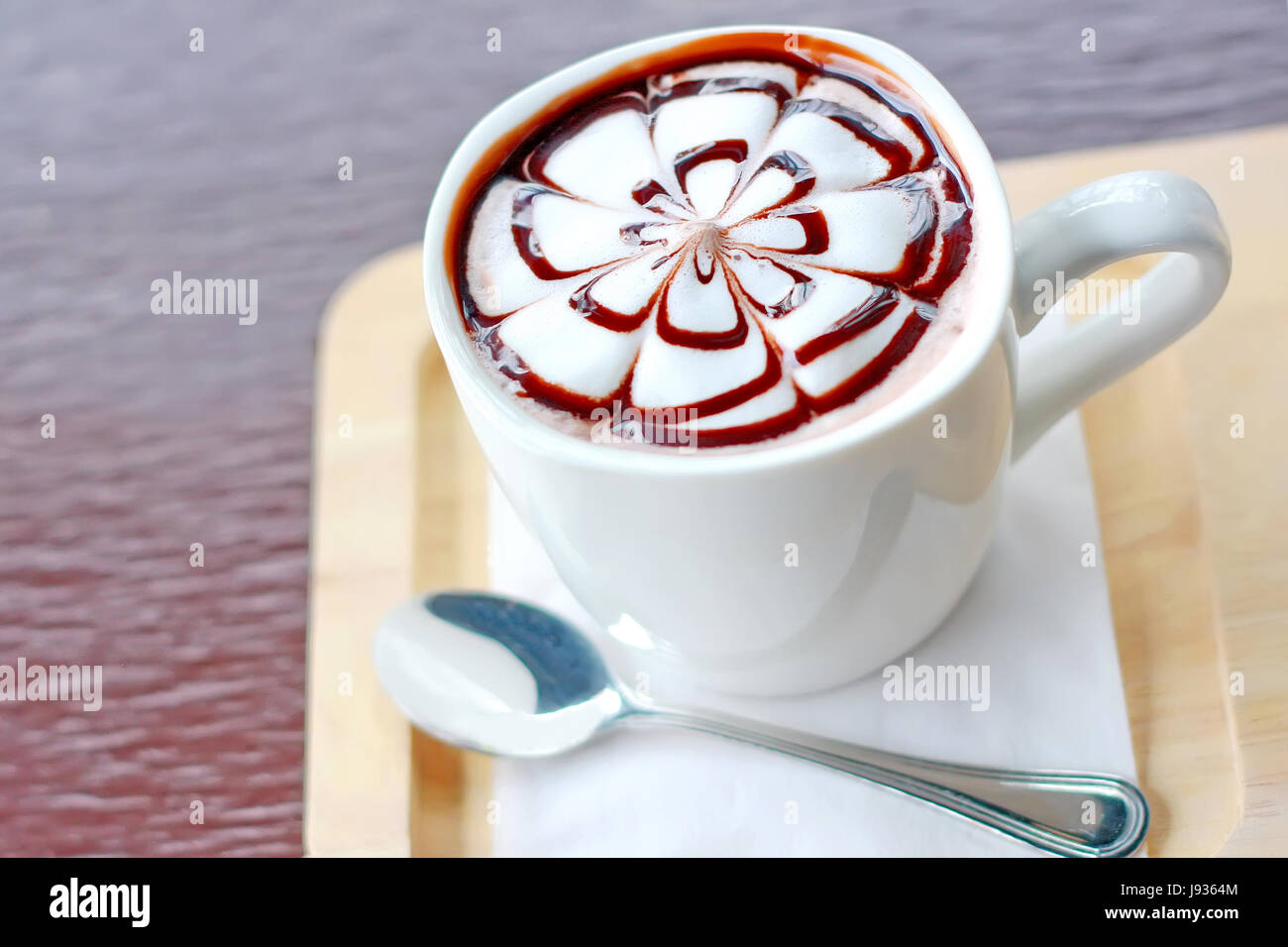 Top view of cup of hot chocolate with foam in the form of flower on ...