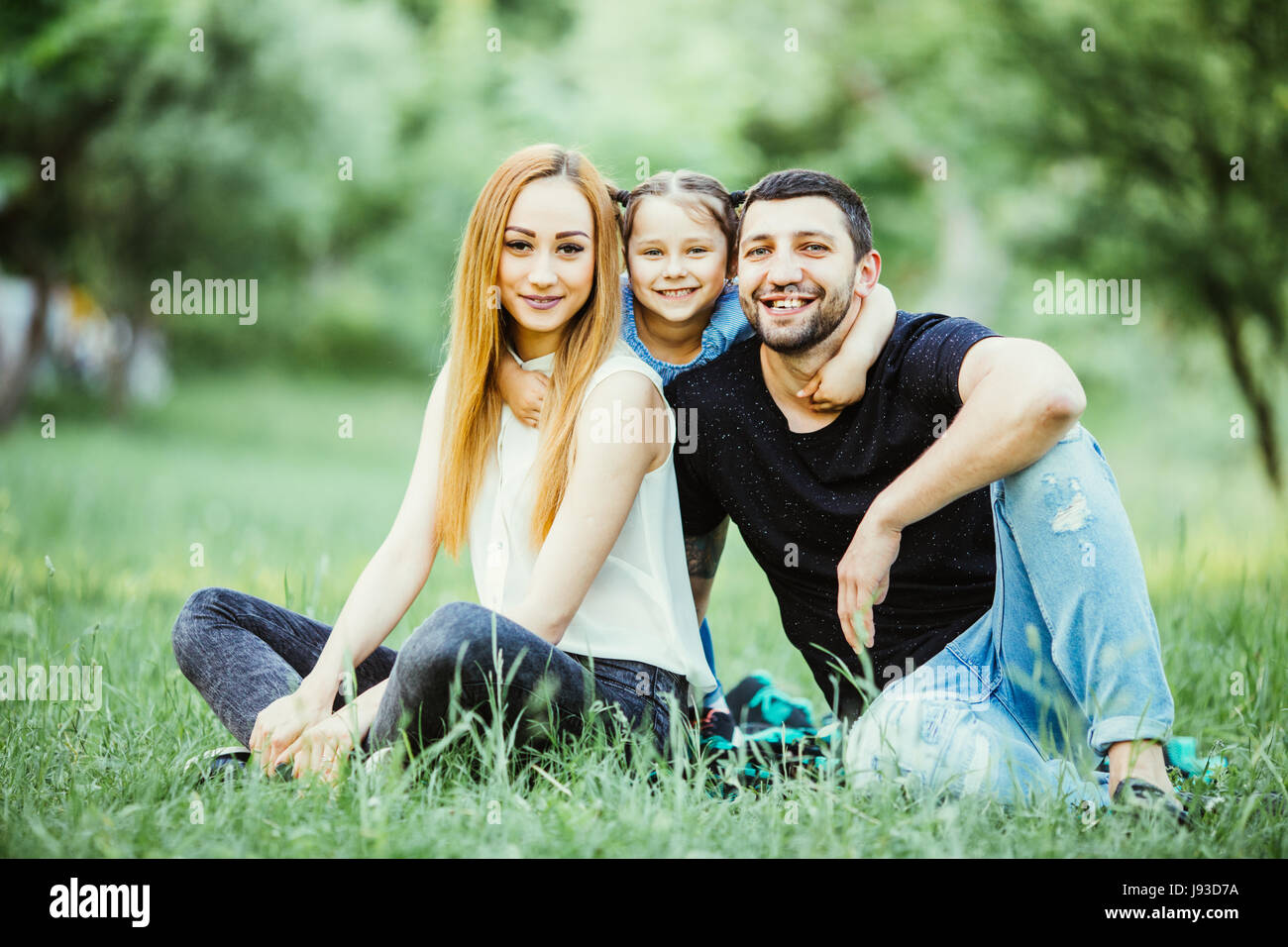 Young family of three having fun together outdoor. Happiness and ...