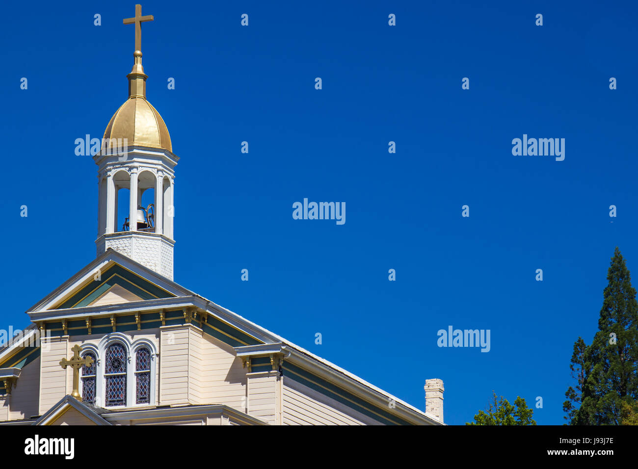 Church Steeple With Gold Dome & Cross Against Blue Sky Stock Photo - Alamy