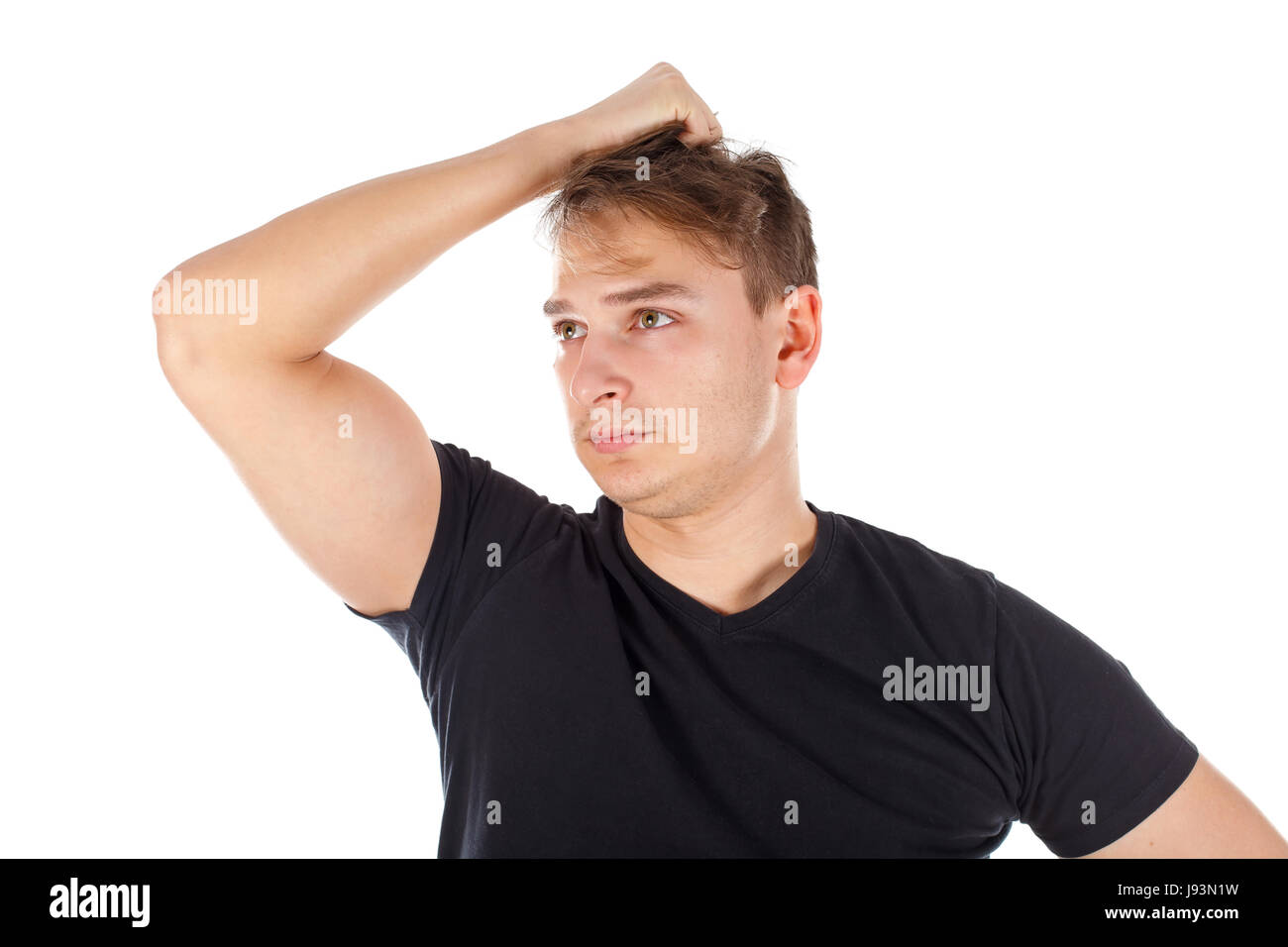 Picture of a stressed young man standing on an isolated background ...