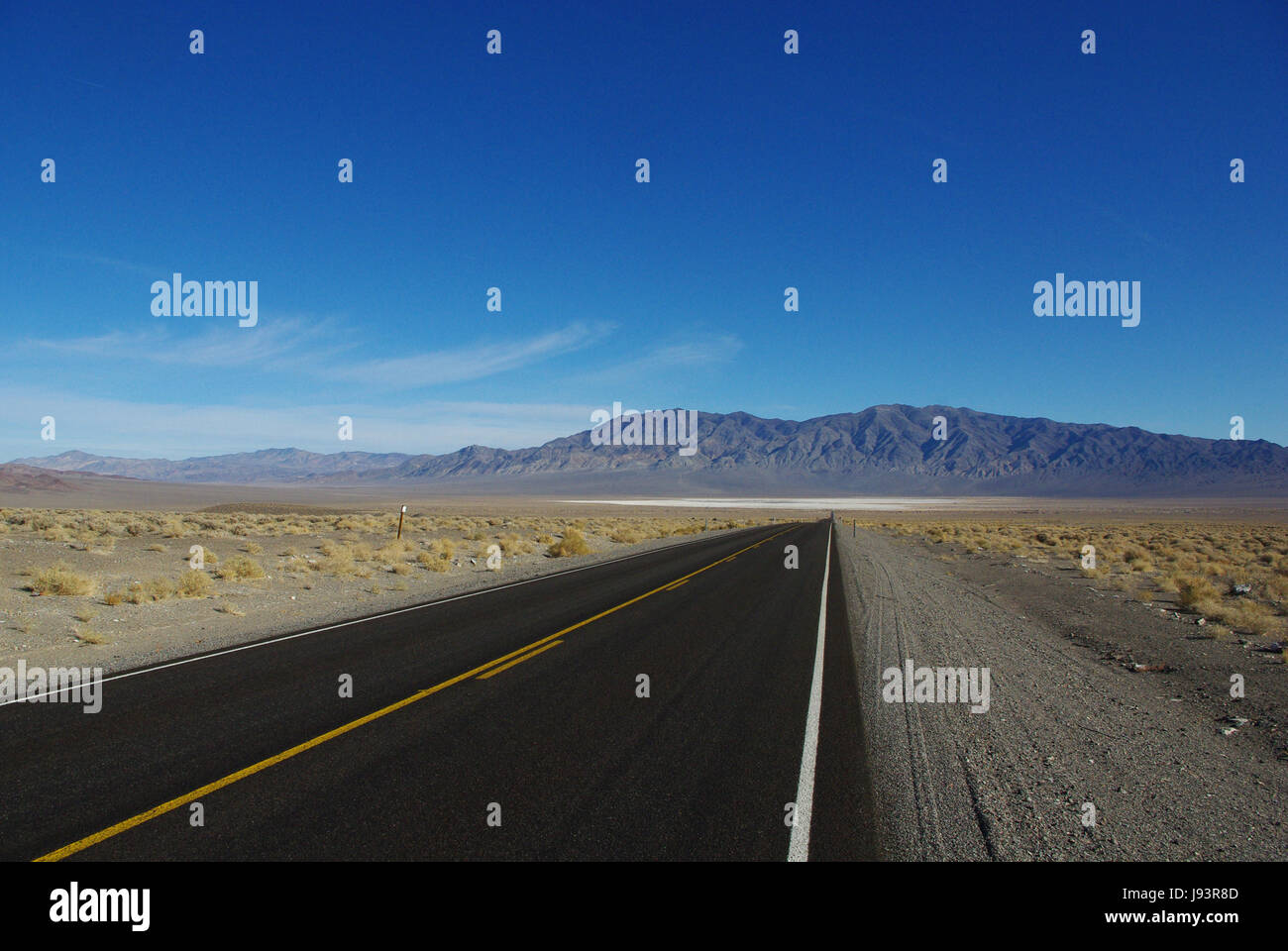 highway to salt flats and high mountain range,nevada Stock Photo - Alamy