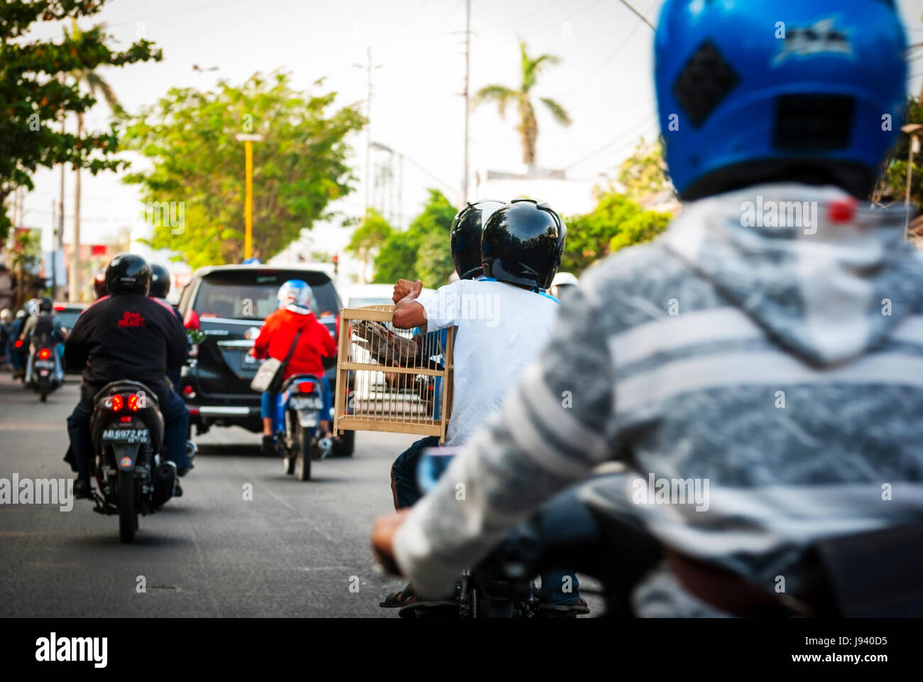 YOGYAKARTA, INDONESIA - SEPTEMBER 15: Driving in a local road between ...