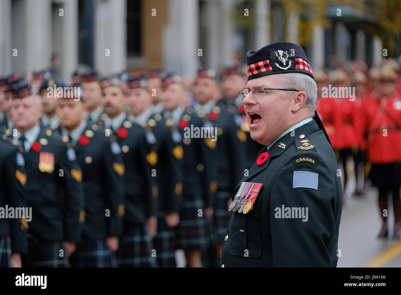 This officer shouts an order to the members of Highland Regiments ...