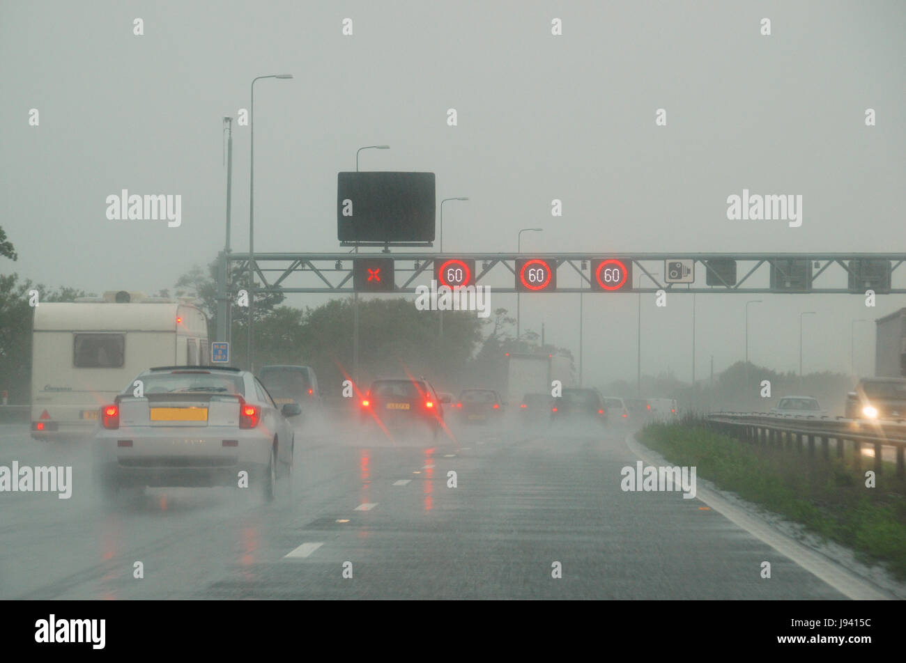 Motorway driving in poor wet weather conditions Stock Photo - Alamy