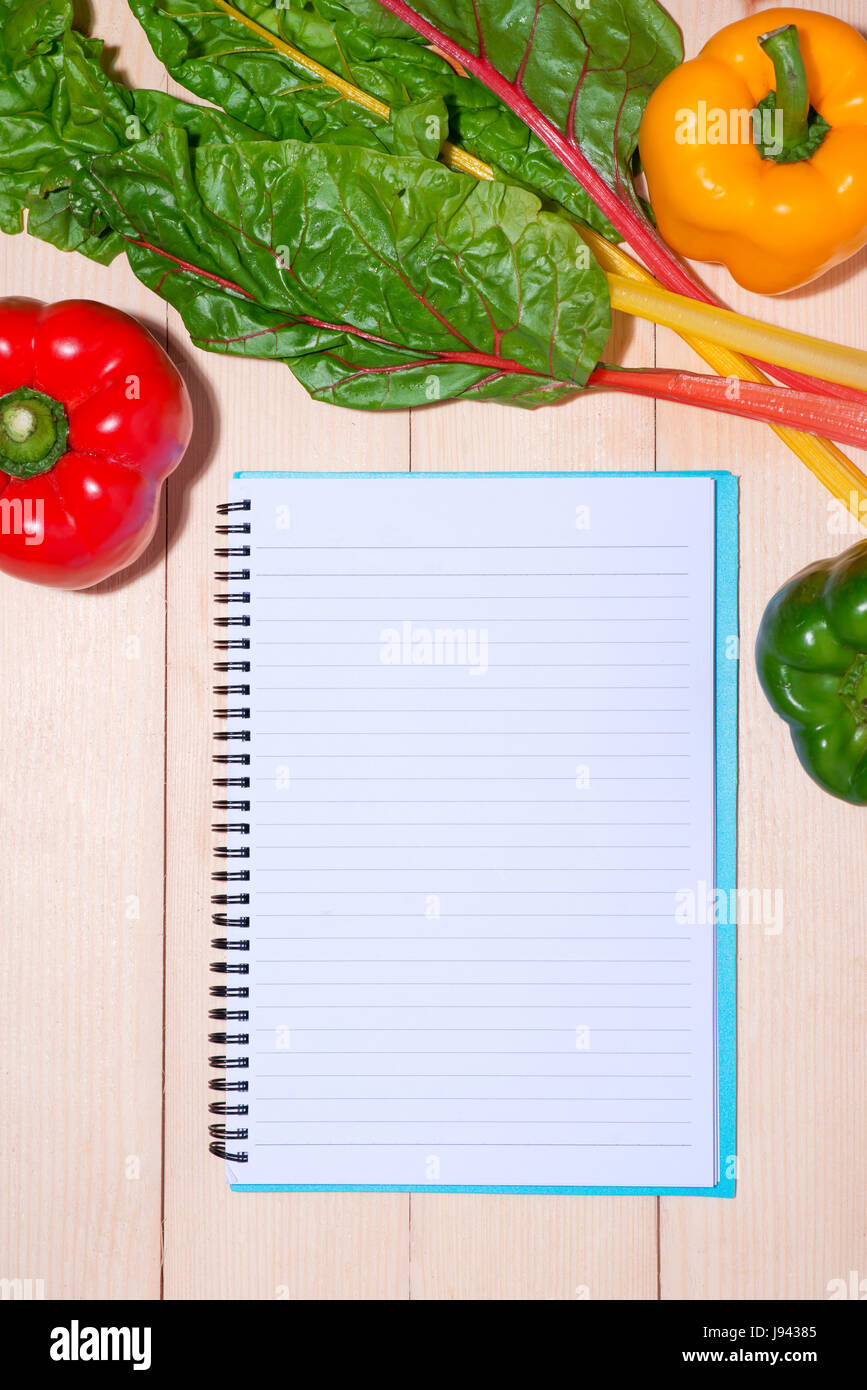 Notebook for culinary recipes with fresh organic vegetables Stock Photo ...