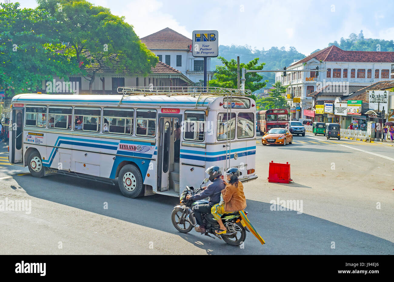KANDY, SRI LANKA - NOVEMBER 28, 2016: Big old buses run with open doors ...