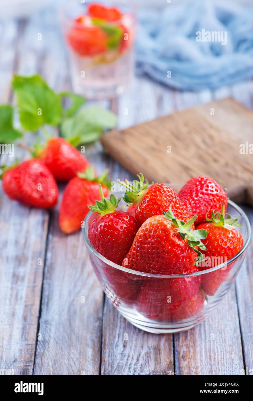 fresh strawberry in bowl and on a table Stock Photo - Alamy