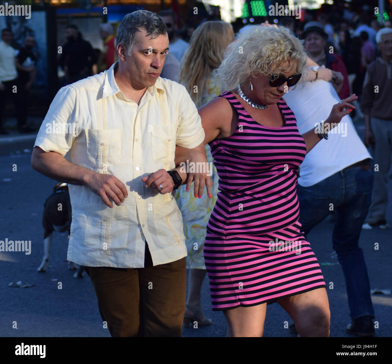 A couple is dancing salsa in the street Stock Photo - Alamy