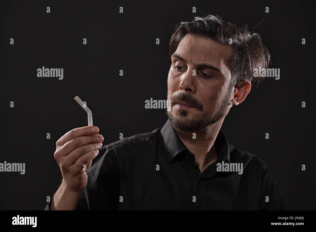 Portrait of adult man who is decided to quit smoking Stock Photo - Alamy
