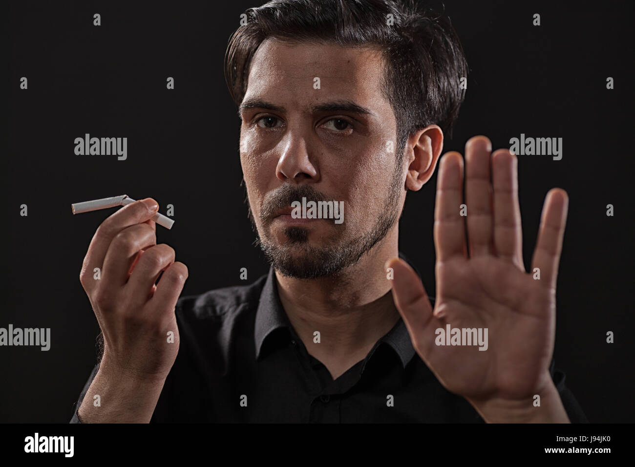 Stop smoking man holding hi-res stock photography and images - Alamy