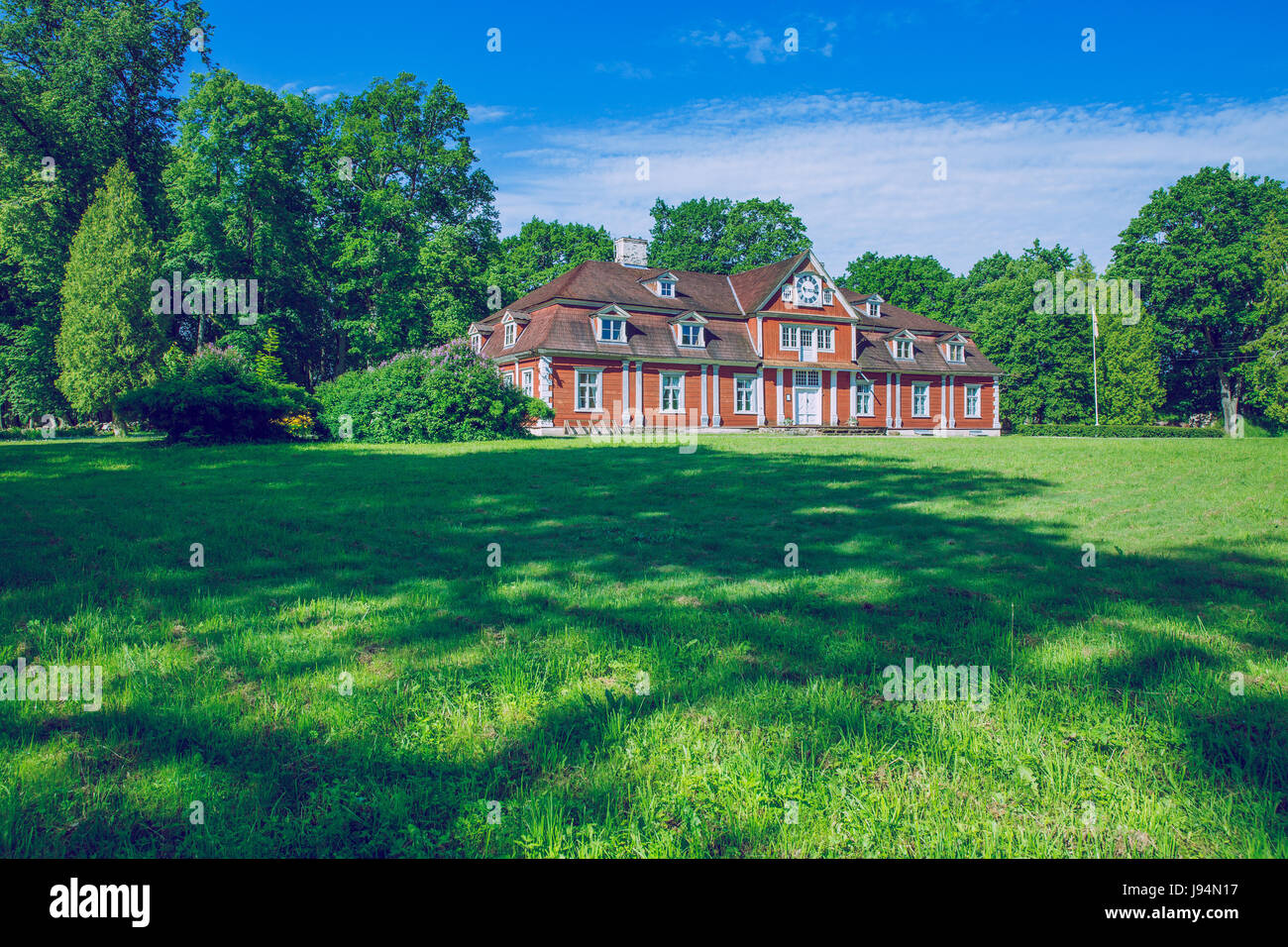 Red manor with old wood style in Latvia. 2015 Stock Photo - Alamy