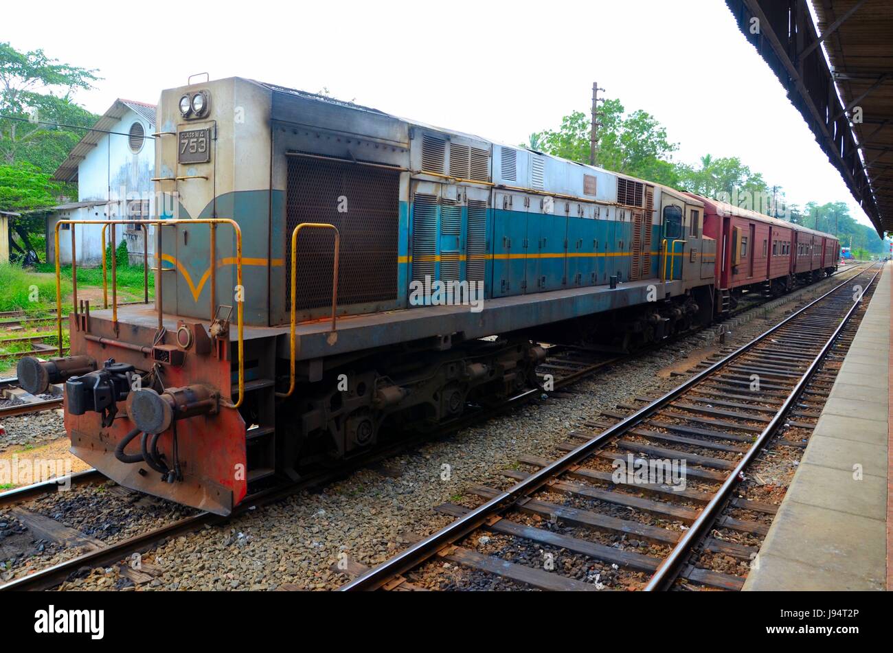 Weathered and oily Sri Lankan Railways diesel electric locomotive train ...
