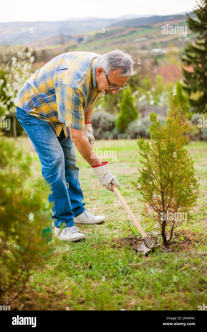 Garden hoe man hi-res stock photography and images - Alamy