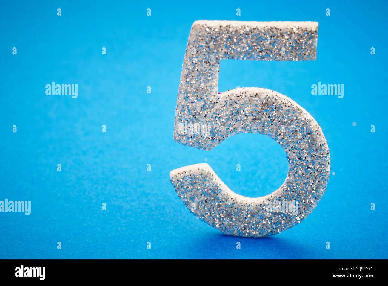 Number five silver color over a blue background. Anniversary ...