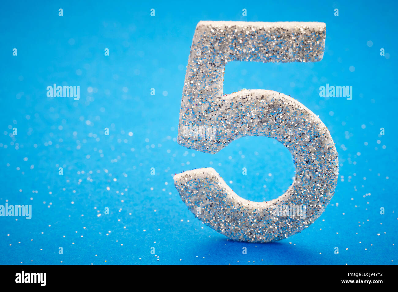 Number five silver color over a blue background. Anniversary ...