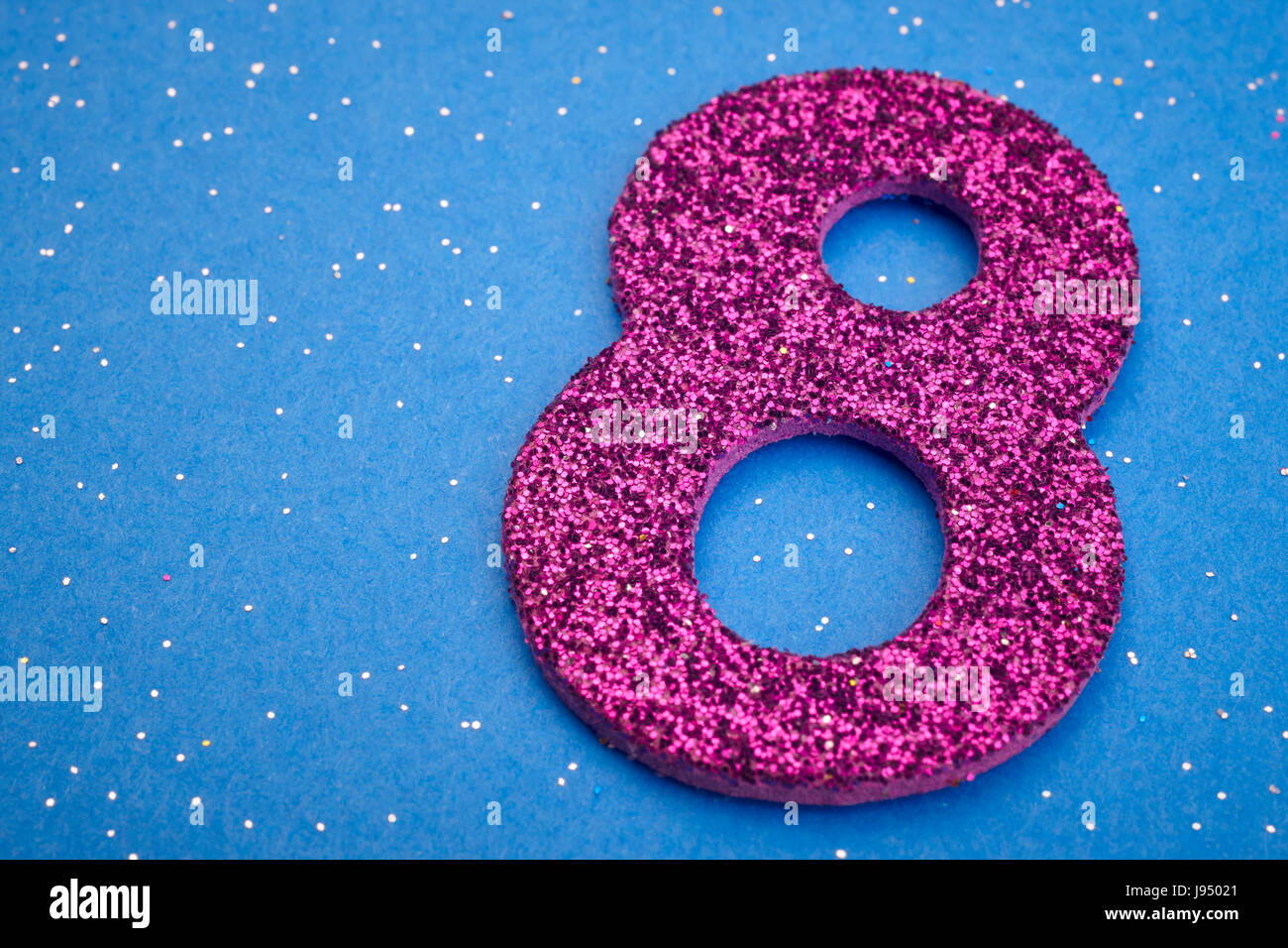 Number eight purple color over a blue background. Anniversary ...