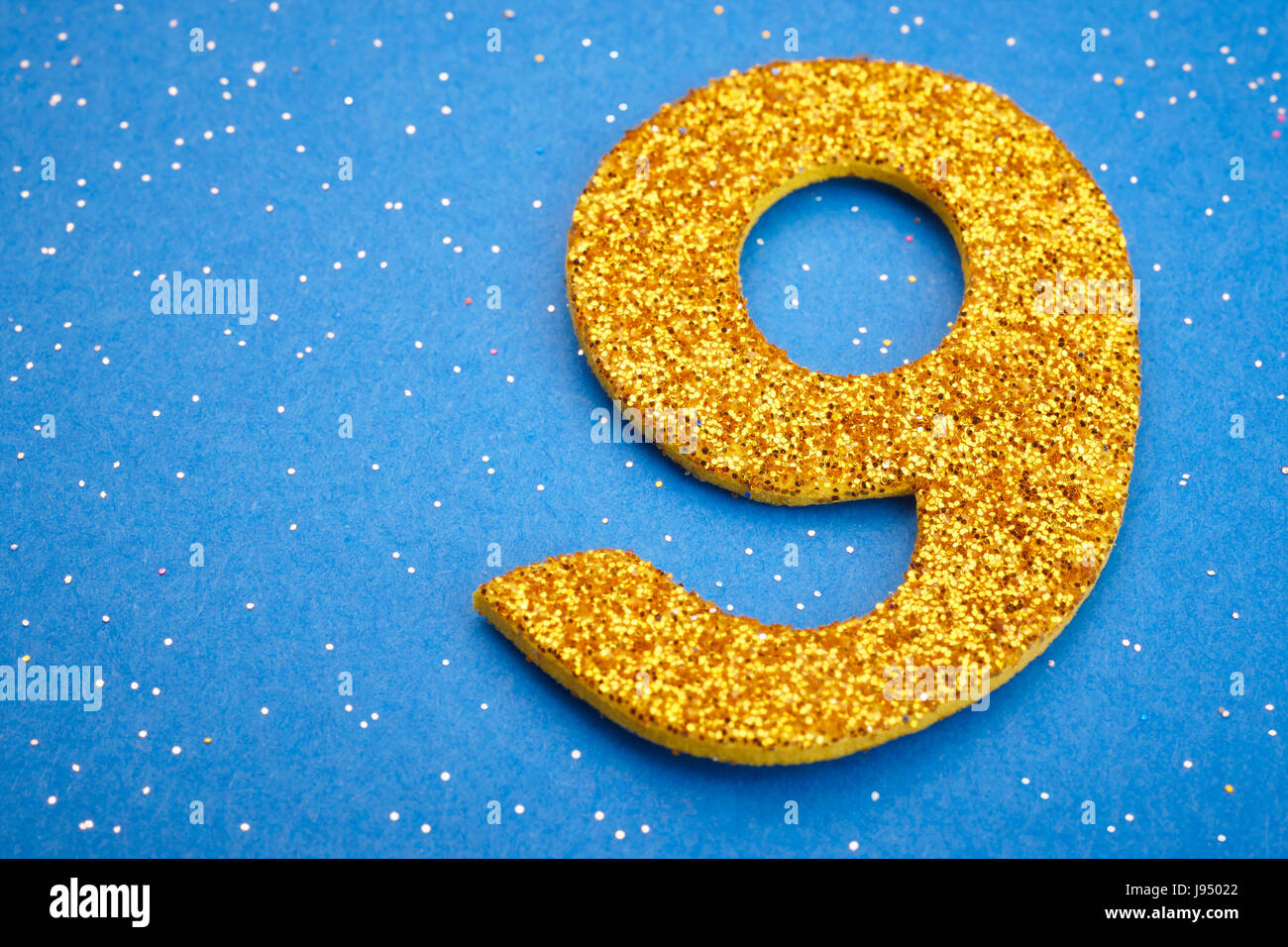 Number nine yellow color over a blue background. Anniversary ...