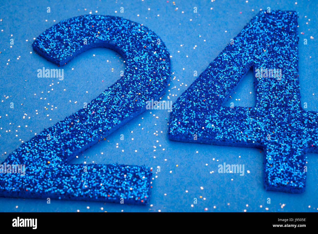 Number twentyfour blue color over a blue background. Anniversary ...